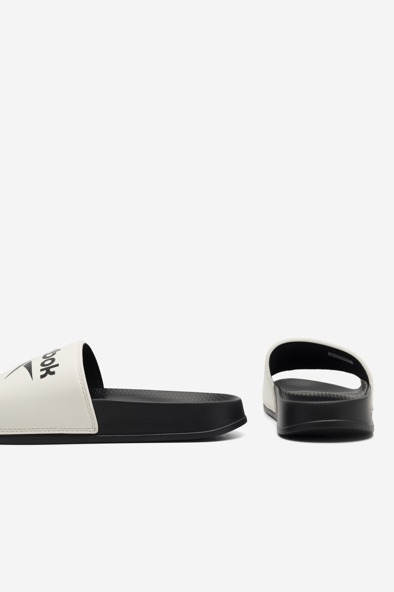 Klapki basenowe Reebok FULGERE SLIDE HR0390 Biały - CCC.eu